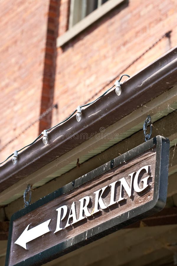 Custom Parking Sign with Arrow on Side of Building Stock Photo - Image ...