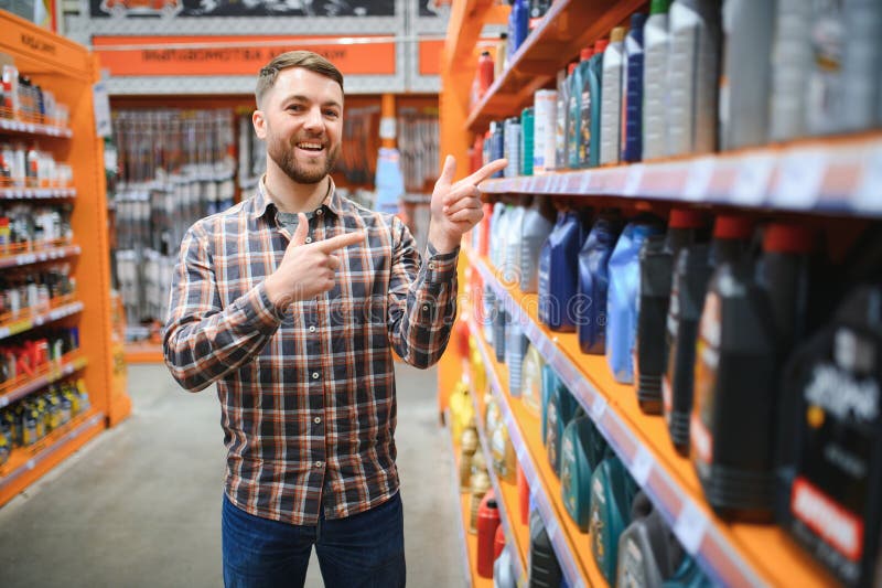 A Customer at an Auto Parts Store Stock Photo - Image of assistant ...