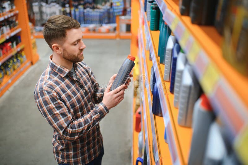 A Customer at an Auto Parts Store Stock Photo - Image of explaining ...