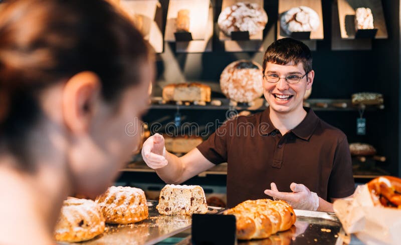Salesman in a bakery stock photo. Image of sale, eating - 62349456