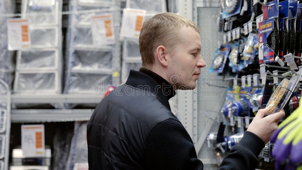 Customer Carefully Comparing Tool Models while Reading Package ...