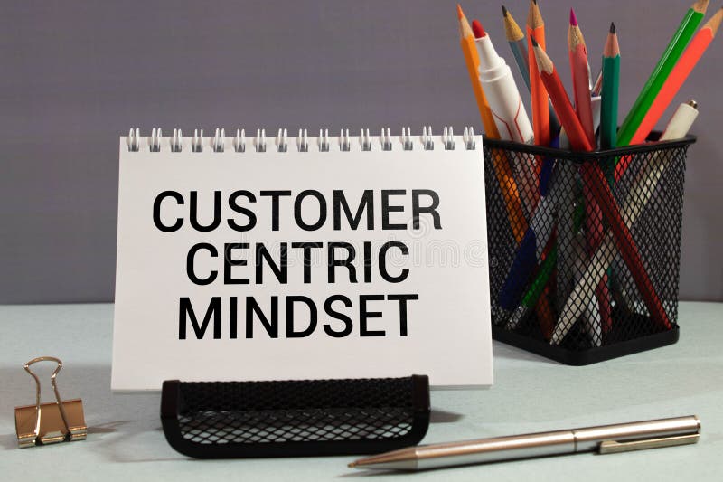Customer Centric Mindset Write on a Book Isolated on Office Desk Stock ...