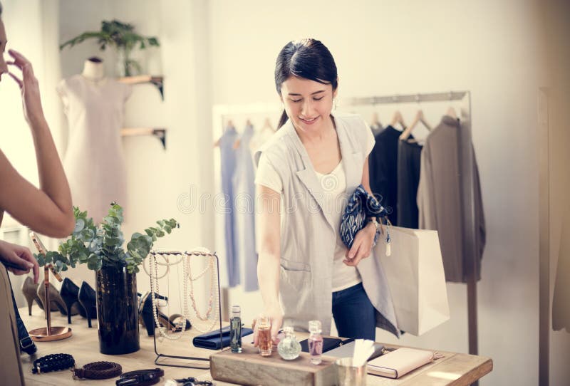 Customer Checking Out Clothes and Perfume Stock Image - Image of ...