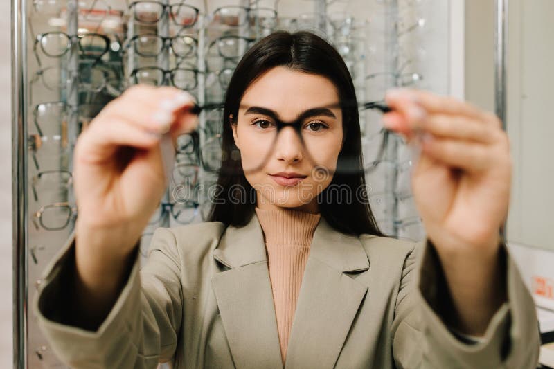 Customer Chooses Eyeglasses with Clear Lenses from the Shelf. Eyesight Correction Stock Photo ...