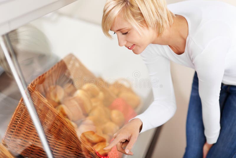 Customer Choosing Bread from Display Cabinet in Cafe Stock Image ...