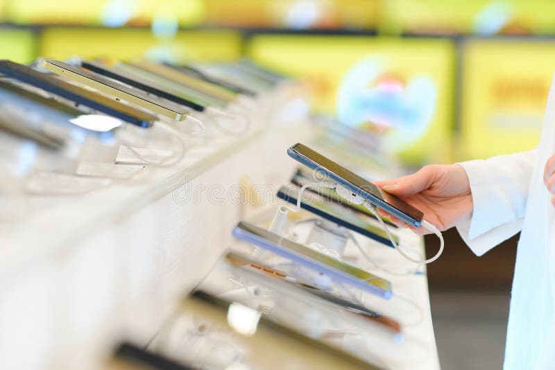 Customer Choosing a New Mobile Phone in a Shop Stock Photo - Image of ...
