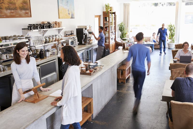 Customer at a Counter of a Busy Coffee Shop, Elevated View Stock Image ...