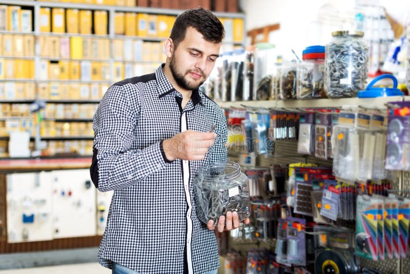 Customer Examining Various DIY Details Stock Image - Image of european ...