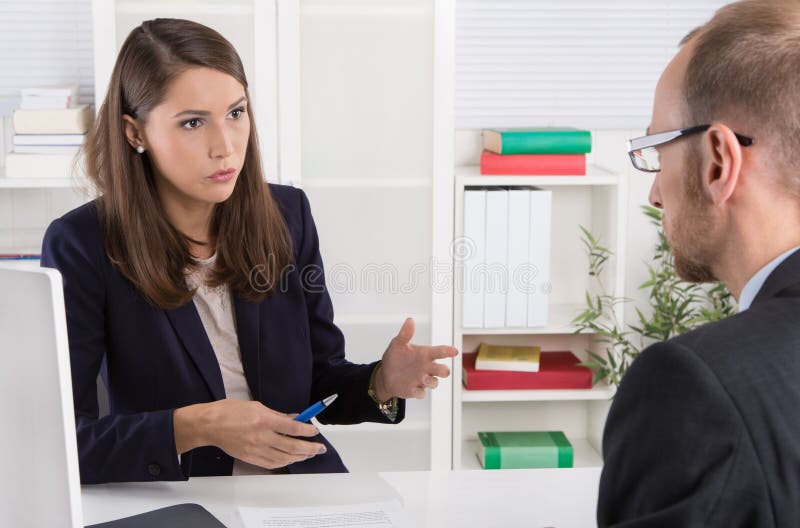 Customer and Female Financial Agent in a Discussion at Desk. Stock ...
