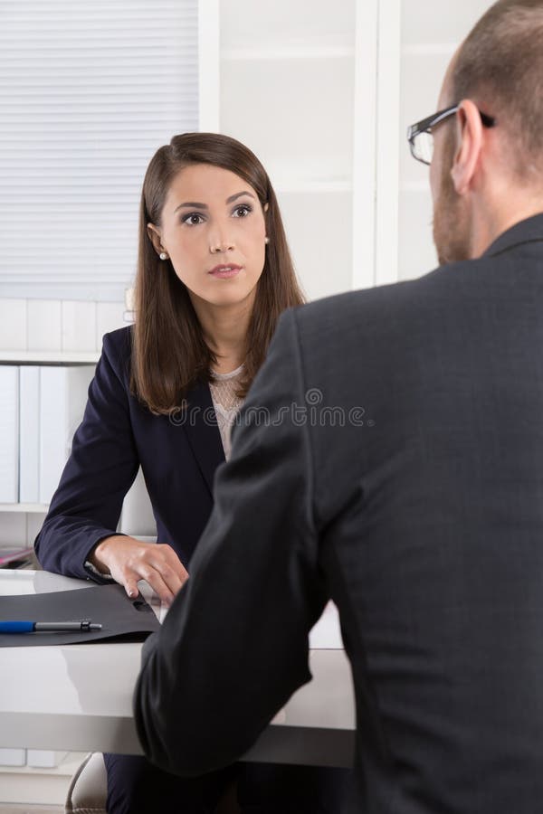 Customer and Female Financial Agent in a Discussion at Desk. Stock ...