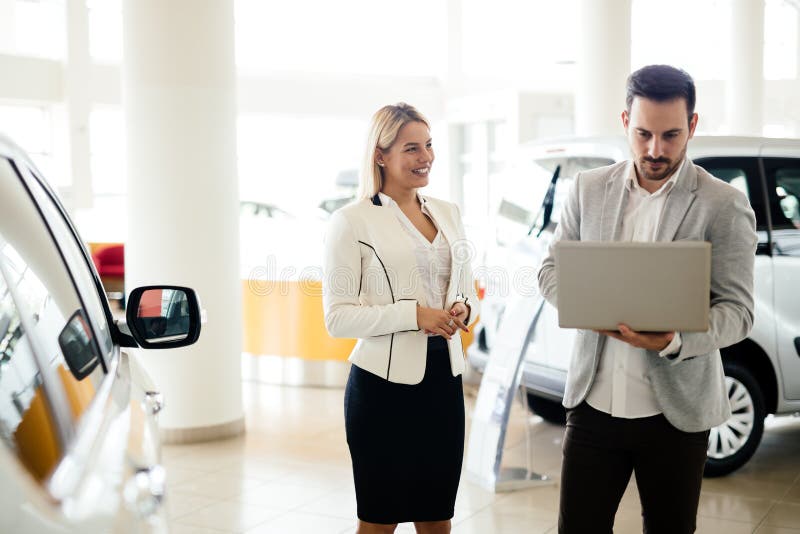 Customer Looking for a Car at Dealership Stock Photo - Image of ...