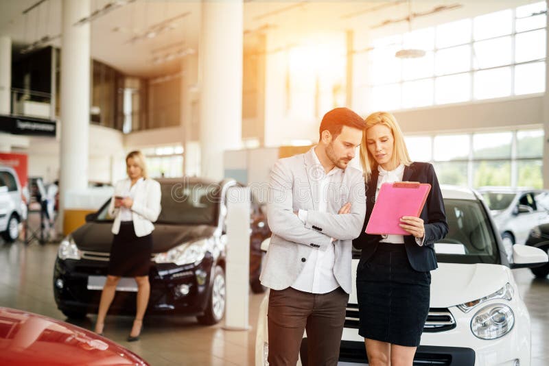 Customer Looking for a Car at Dealership Stock Image - Image of ...
