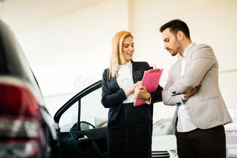 Customer Looking for a Car at Dealership Stock Image - Image of ...