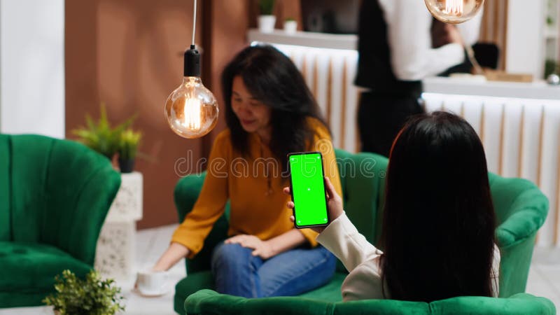 Customer Looking at Greenscreen Layout on Phone Display Stock Video ...