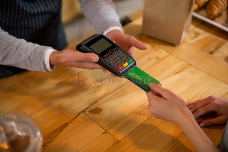 Customer Making Payment through Credit Card at Counter Stock Image ...