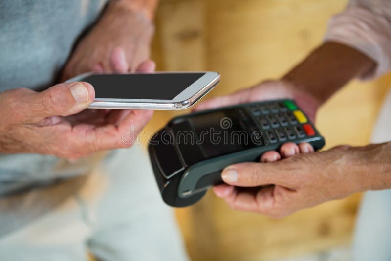 Customer Making Payment through NFC Technology on Mobile Phone Stock ...