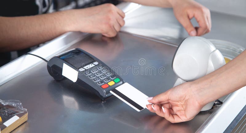 Customer Making Payment Using Credit Card in a Supermarket Stock Photo ...