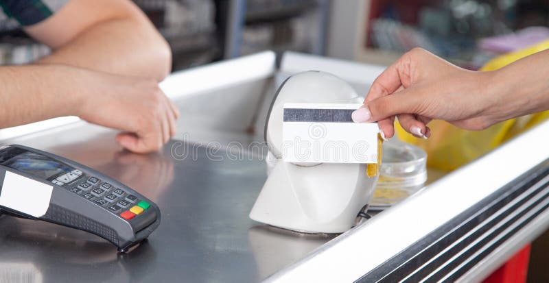 Customer Making Payment Using Credit Card in a Supermarket Stock Photo ...