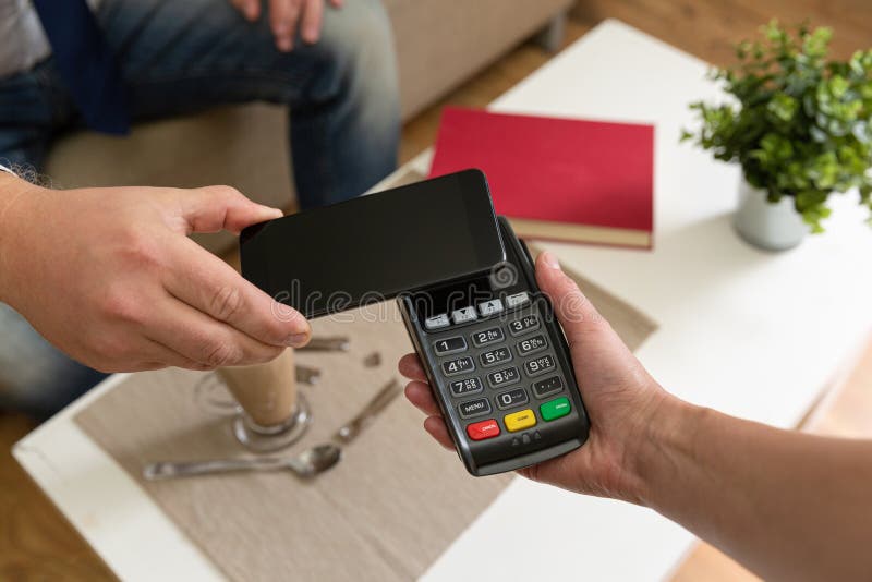 Customer Making Payment Using Credit Card in a Supermarket Stock Photo ...