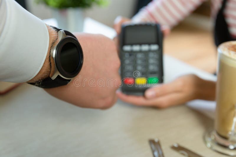 Customer Making Wireless or Contactless Payment Using Smartwatch. Store ...