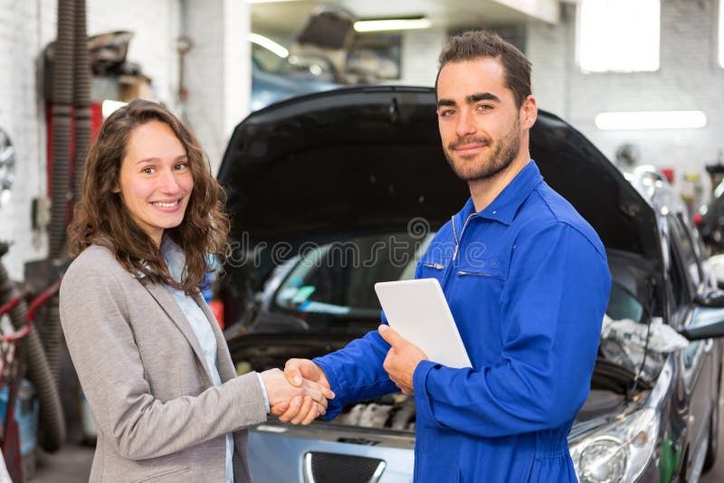 Customer and Mechanic at the Garage Stock Photo - Image of woman ...