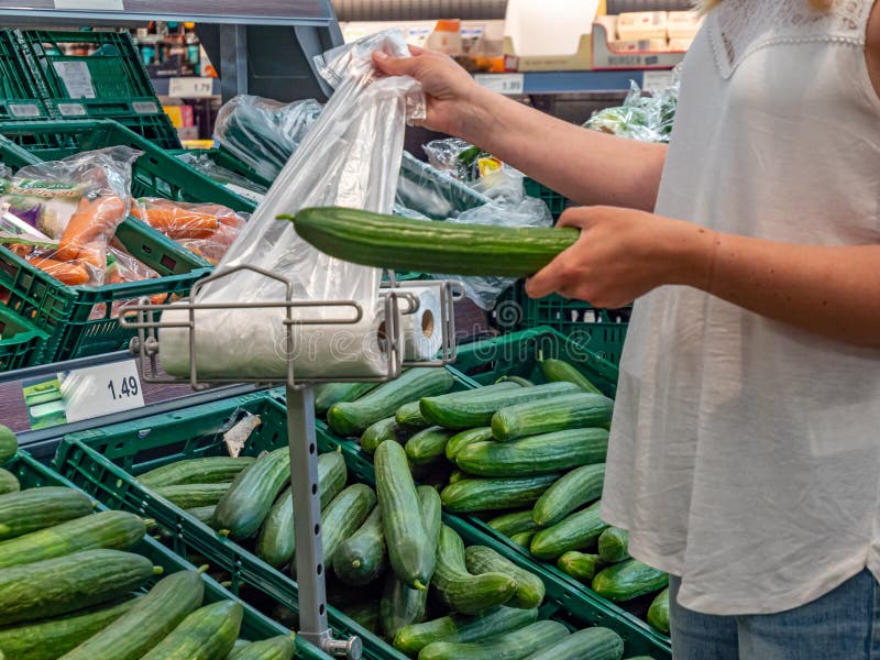 Customer is Packing Cucumber in Plastic Bag Stock Image - Image of ...