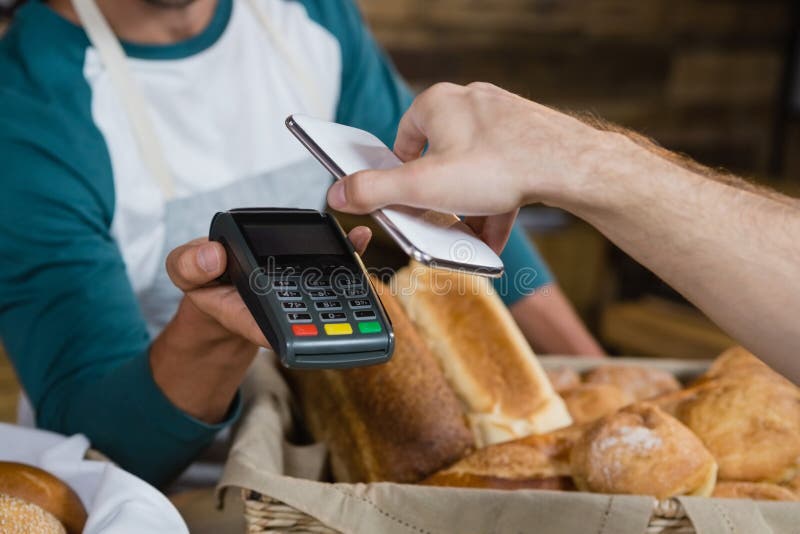 Customer Paying Bill through Smartphone Using NFC Technology at Counter ...