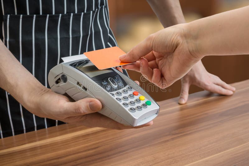 Customer is Paying Using Credit Card and Entering Pin in Payment ...