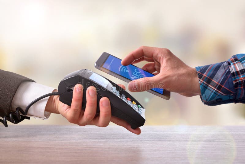 Customer Paying a Merchant with Mobile Phone Nfc Technology Stock Image ...