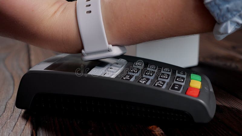 Customer Paying with NFC Technology by Smart Watch Contactless on ...