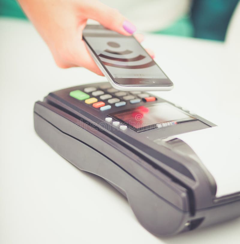 Customer is Paying with Smartphone in Shop Using NFC Technology. NFC ...