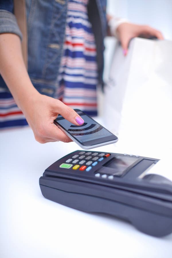 Customer is Paying with Smartphone in Shop Using NFC Technology. NFC ...