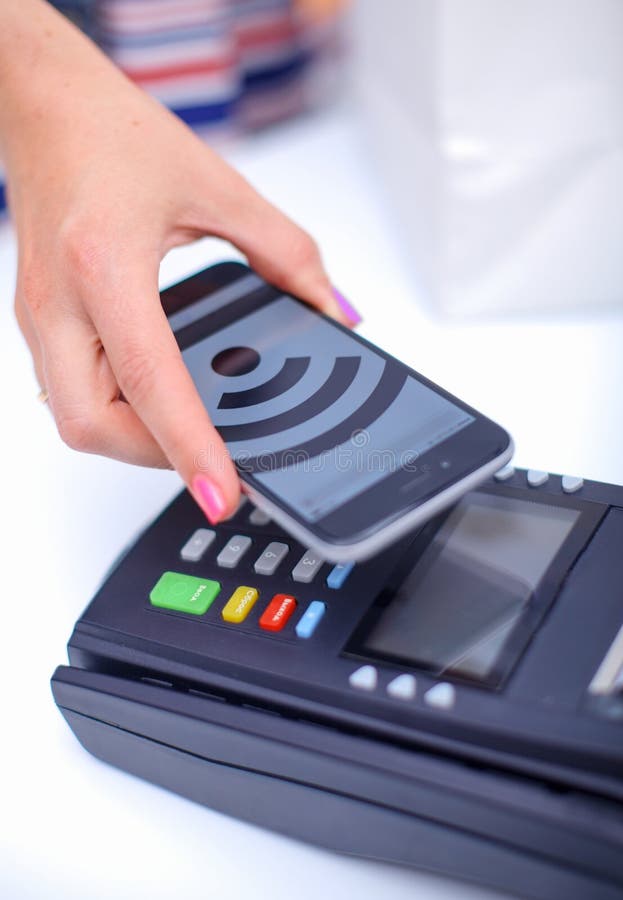 Customer is Paying with Smartphone in Shop Using NFC Technology. NFC ...
