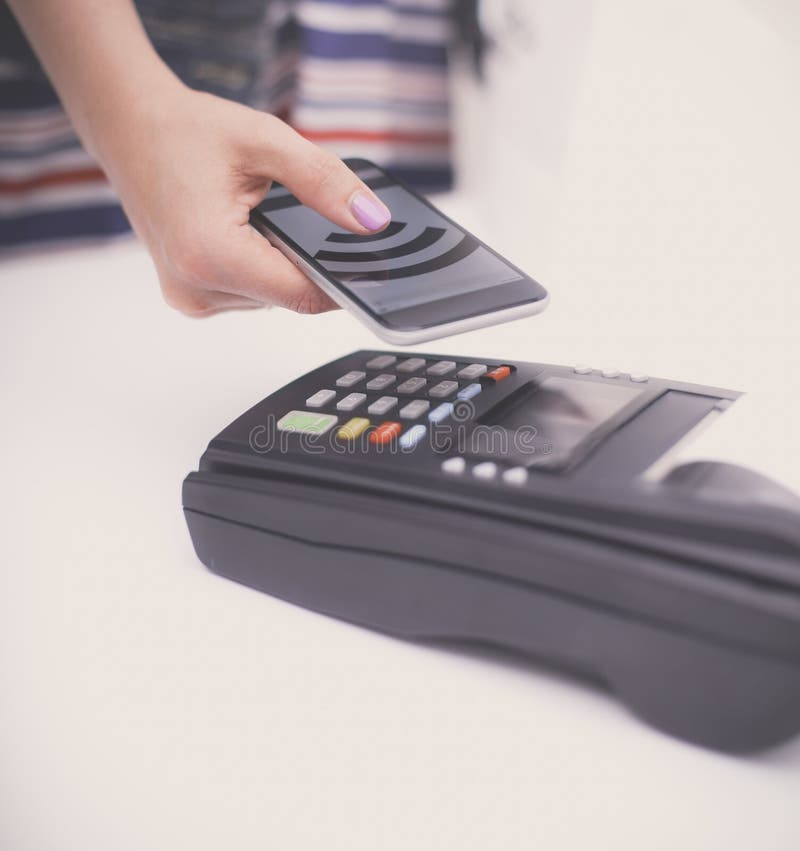 Customer is Paying with Smartphone in Shop Using NFC Technology. NFC ...