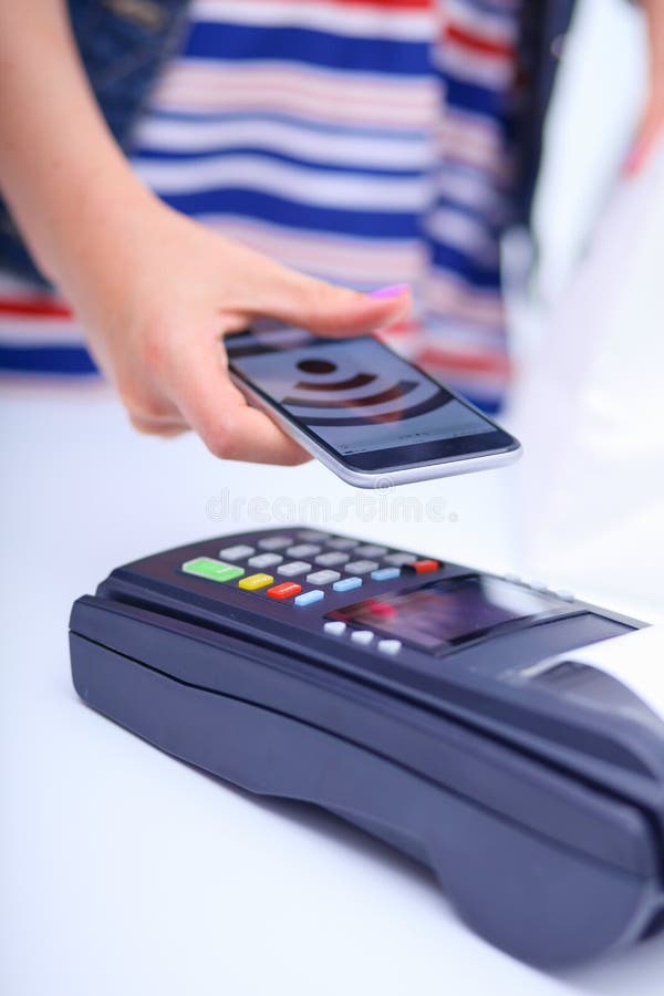 Customer is Paying with Smartphone in Shop Using NFC Technology. NFC ...