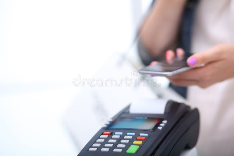 Customer is Paying with Smartphone in Shop Using NFC Technology. NFC ...