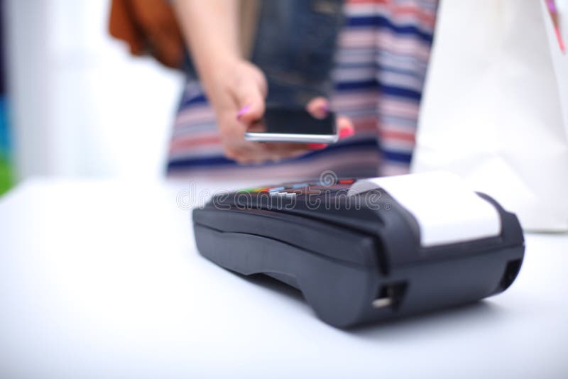 Customer is Paying with Smartphone in Shop Using NFC Technology. NFC ...