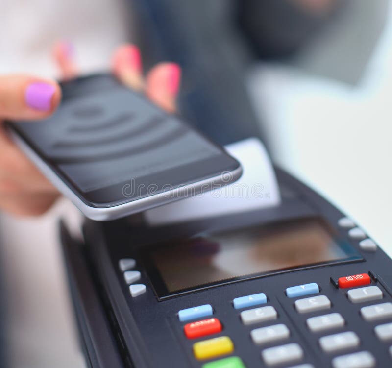 Customer is Paying with Smartphone in Shop Using NFC Technology. NFC ...