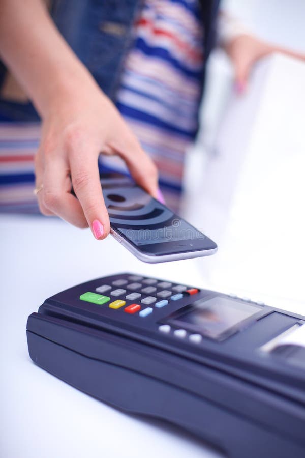 Customer is Paying with Smartphone in Shop Using NFC Technology. NFC ...