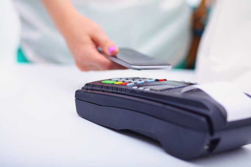 Customer is Paying with Smartphone in Shop Using NFC Technology. NFC ...