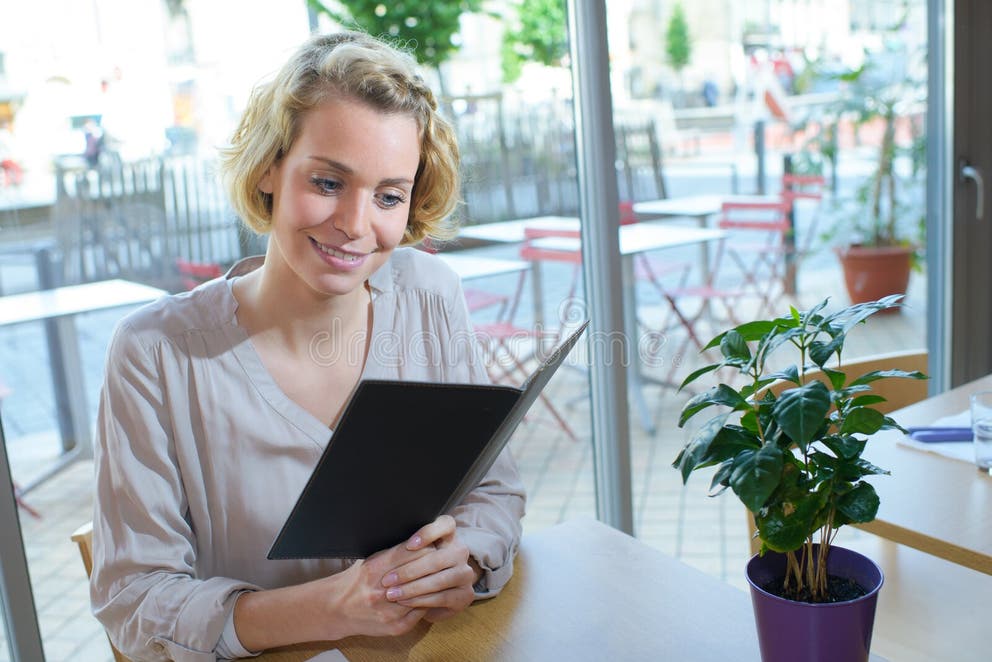 Customer reading the menu stock photo. Image of setting - 128020022