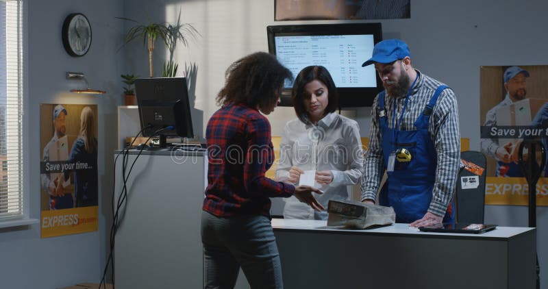 Customer Receiving Damaged Package at Customer Service Desk Stock Photo ...