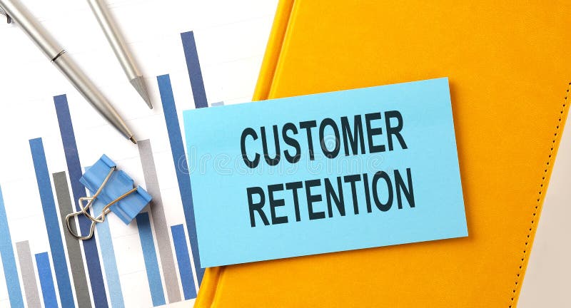 CUSTOMER RETENTION Text on Sticker on the Yellow Notebook with Chart ...