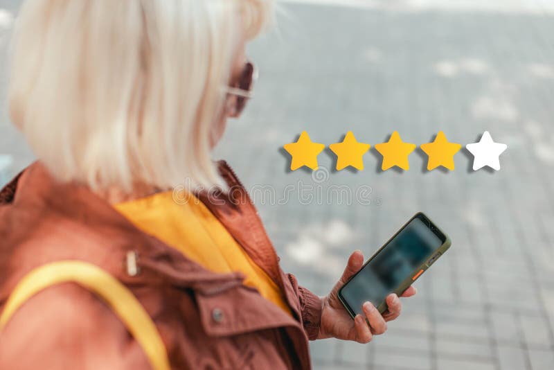 Adult Stylish Woman 50 Years Old Using Smartphone with Icon 4 Star ... Adult Stylish Woman 50 Years Old Using Smartphone with Icon 4 Star ...