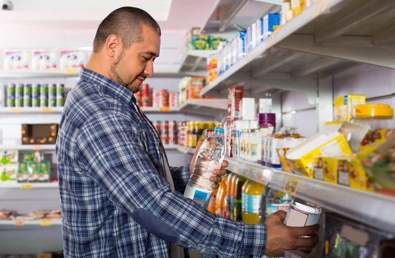 Customer Selecting Bottle of Water Stock Image - Image of buying ...