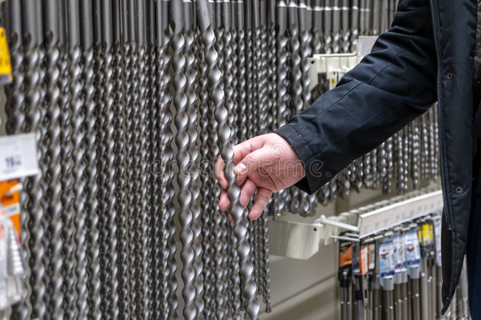 Customer Selecting Twisted Metal Rods in Hardware Store Aisle Stock ...