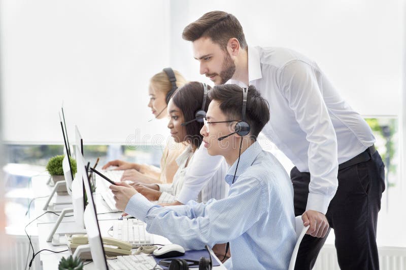 Customer Service Administrator Helping His Supervisee To Execute Client ...