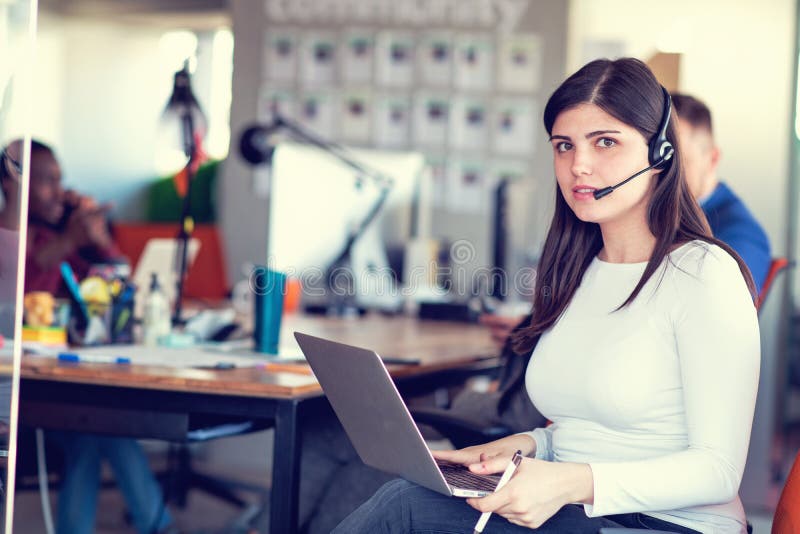Customer Service Agent in an Startup Office with Laptop Stock Photo ...
