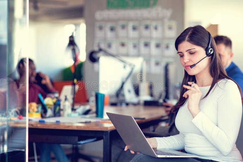 Customer Service Agent in an Startup Office with Laptop Stock Photo ...