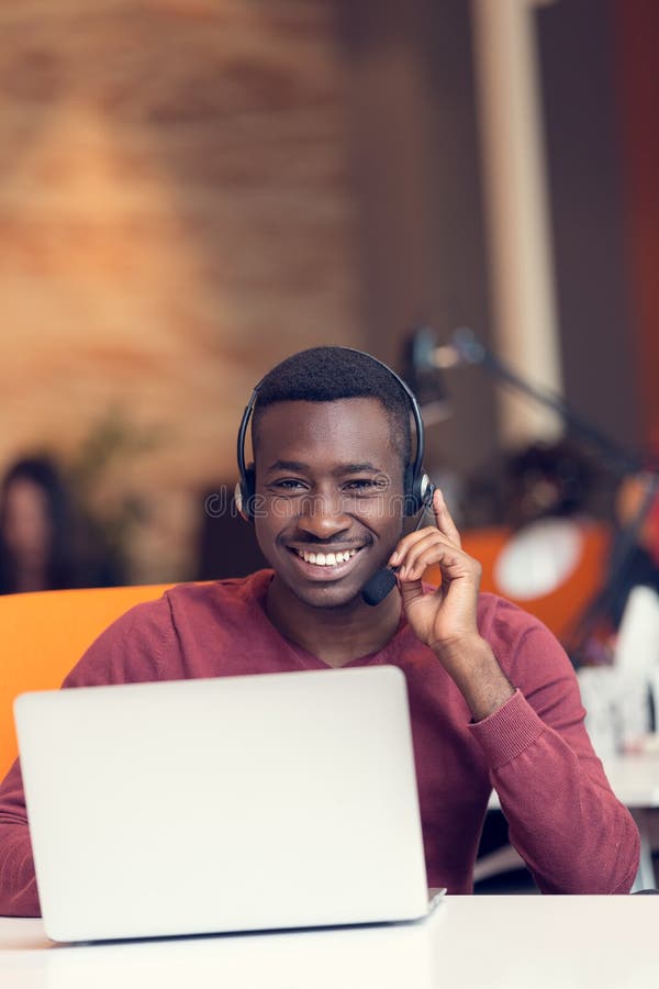 Customer Service Agent in an Startup Office with Laptop Stock Photo ...